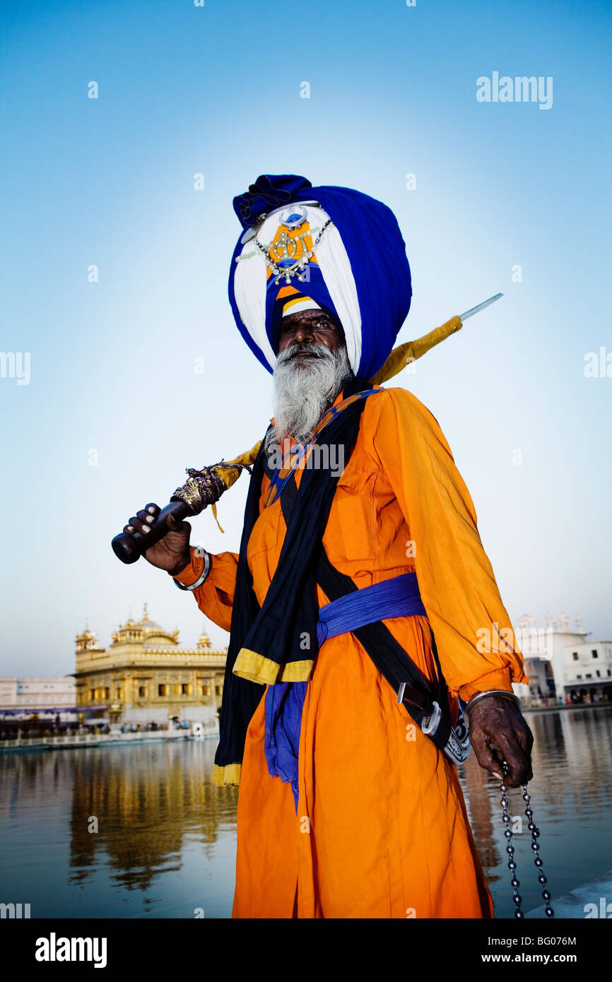 Sikh man with a massive turban and a sword in Golden Temple, Amritsar ...