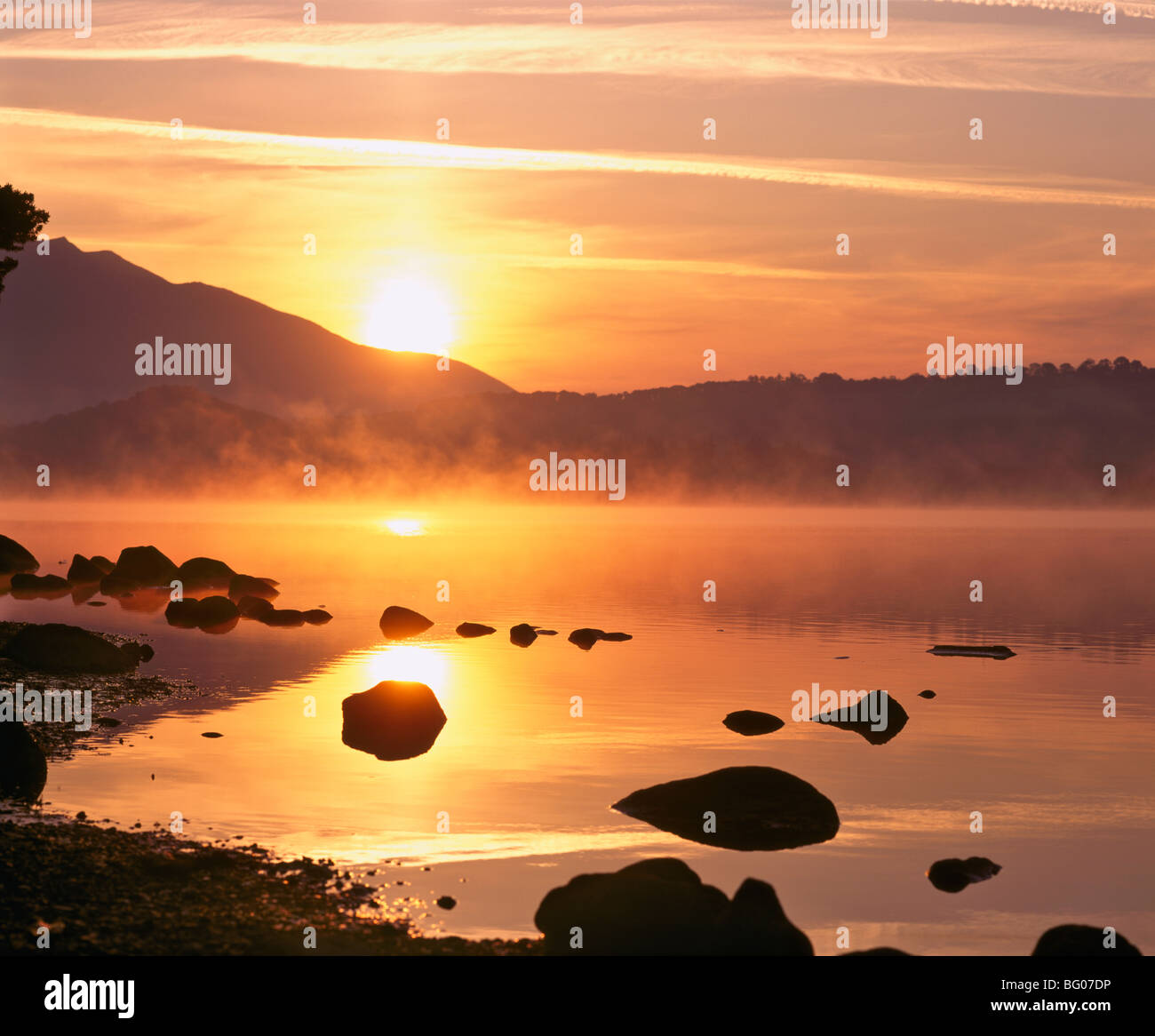 Mist rising on Derwent Water at sunrise, Lake District National Park ...