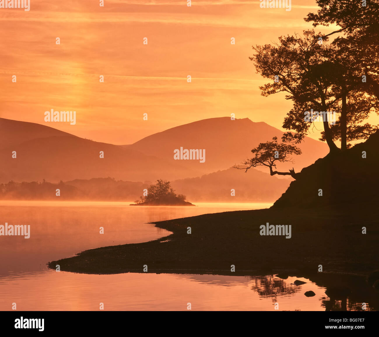 Mist rising on Derwent Water at dawn, Lake District National Park ...