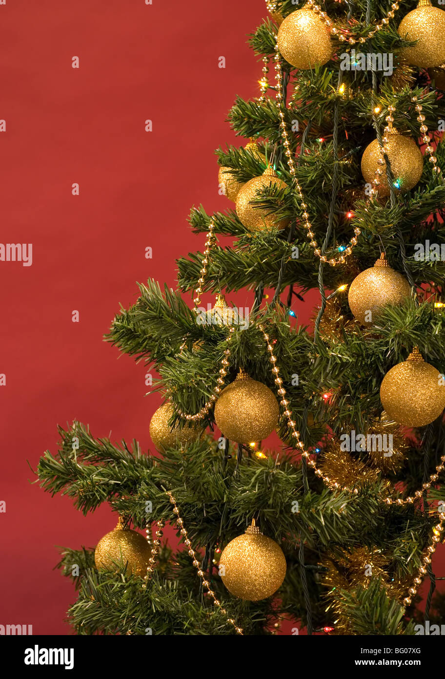 Christmas tree and red background Stock Photo - Alamy