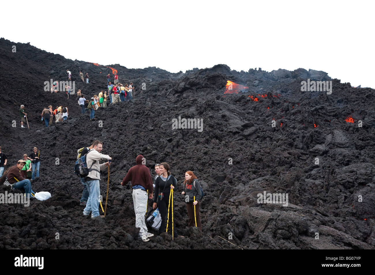 Flowing Lava and Tourists towards the Pacaya Volcano Peak. Volcan ...