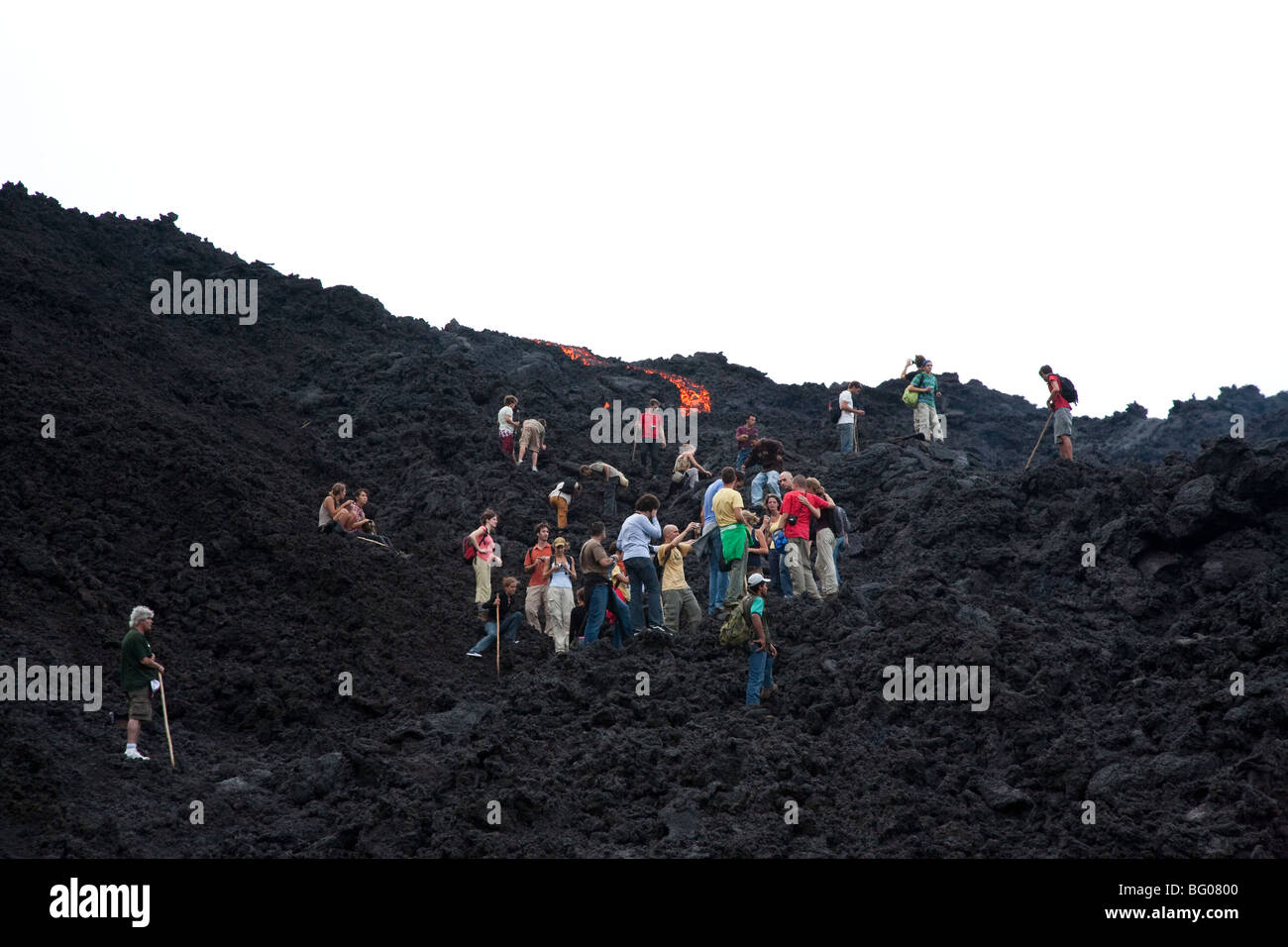 Flowing Lava and Tourists towards the Pacaya Volcano Peak. Volcan ...