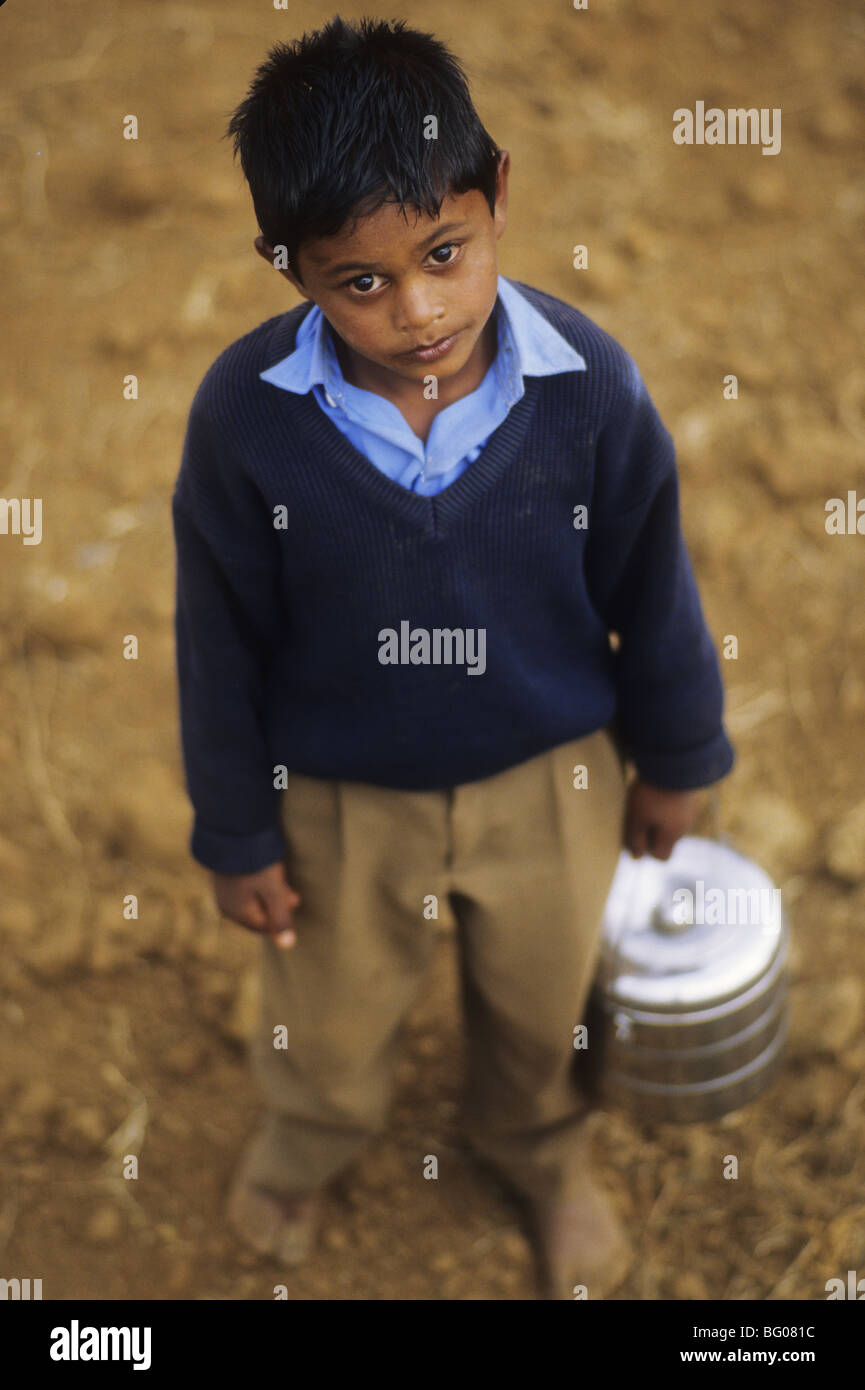 Portrait of young barefoot boy with his lunch bucket, Ooty, India Stock ...
