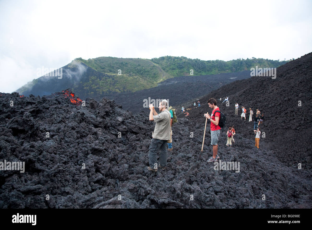 Flowing Lava and Tourists towards the Pacaya Volcano Peak. Volcan ...
