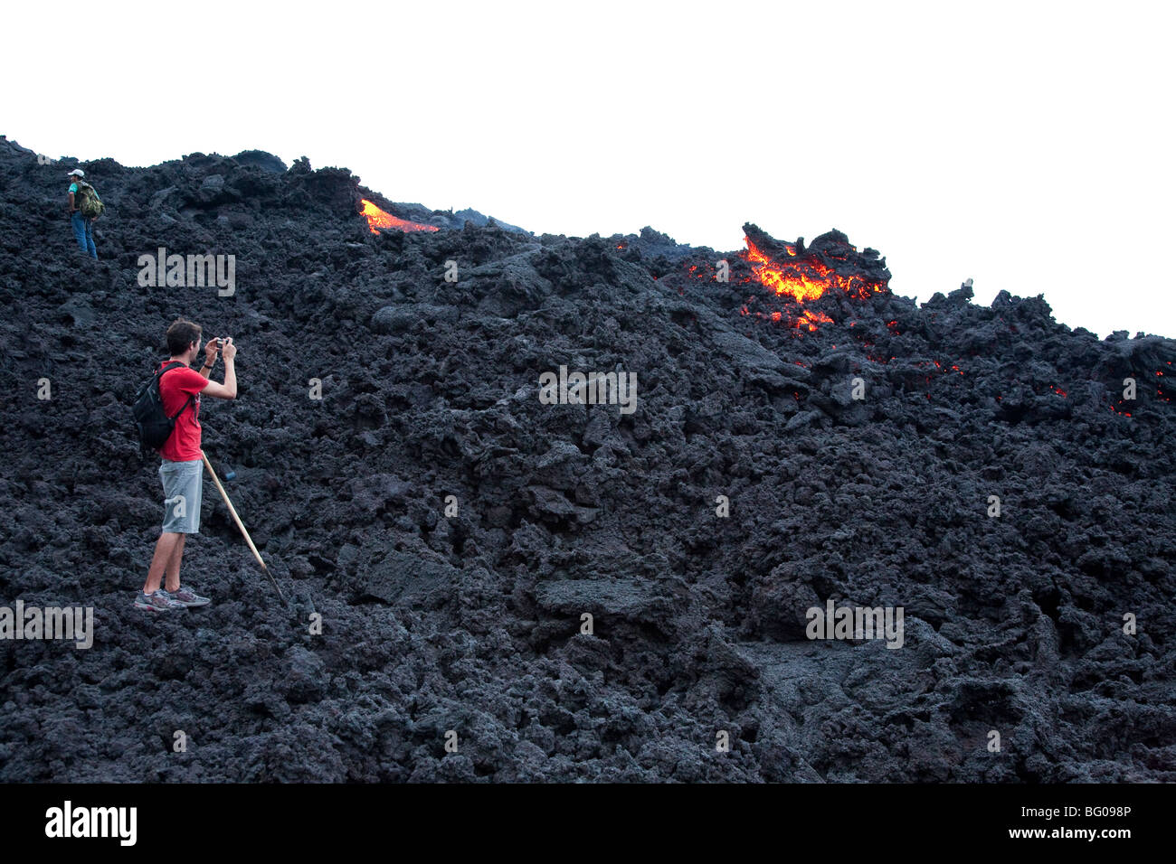 Flowing Lava and Tourists towards the Pacaya Volcano Peak. Volcan ...