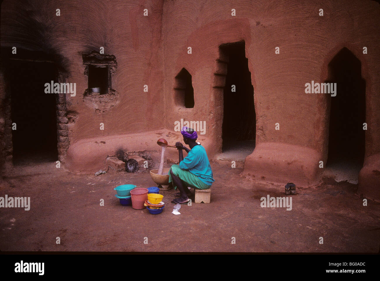 A rice porridge is cooked by a woman in her home in San, Mali, West ...