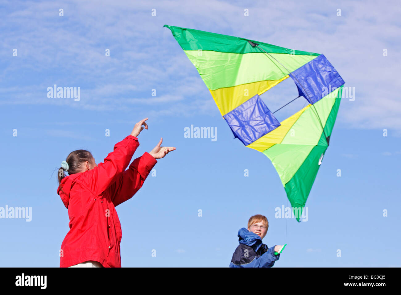 mother and son flying kites Stock Photo - Alamy