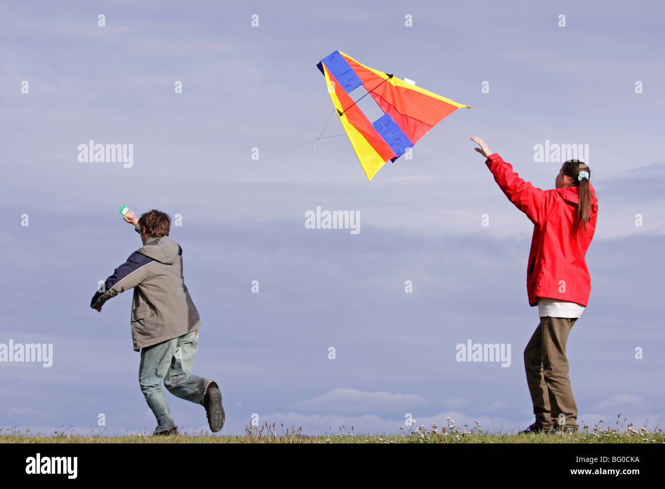 mother and son flying kites Stock Photo - Alamy