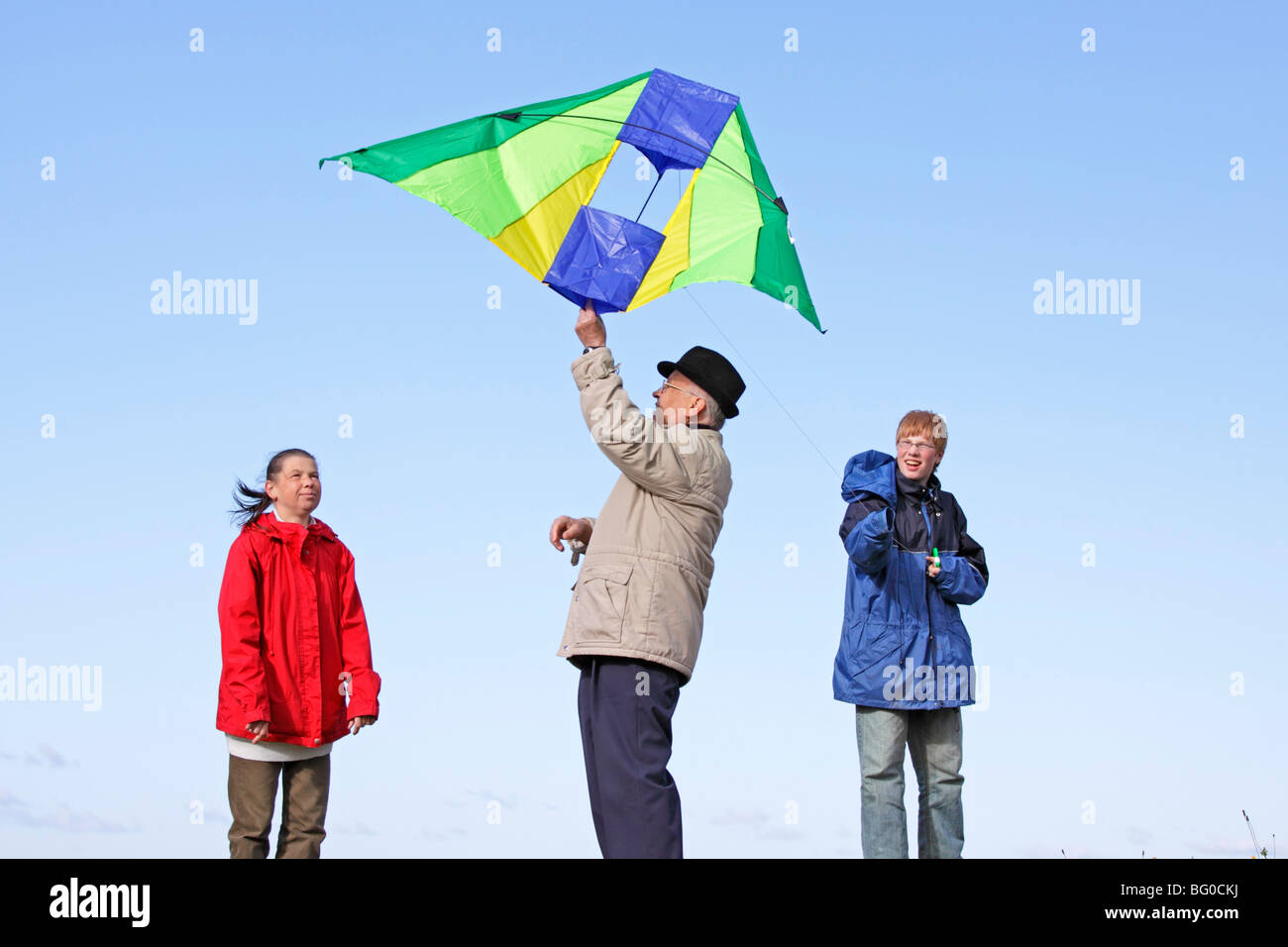 family flying kites Stock Photo - Alamy
