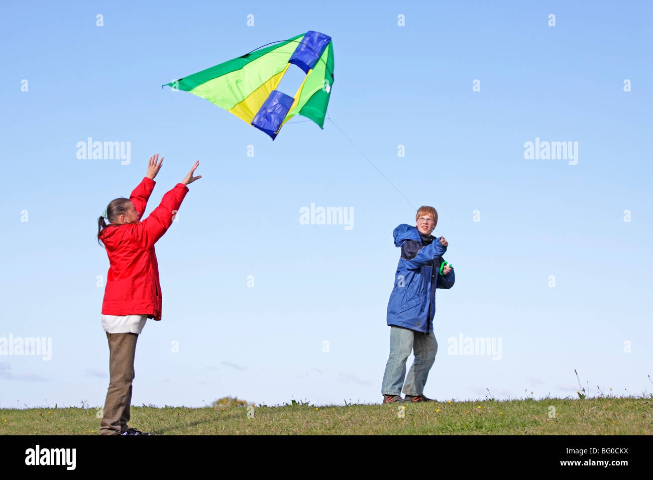 mother and son flying kites Stock Photo - Alamy
