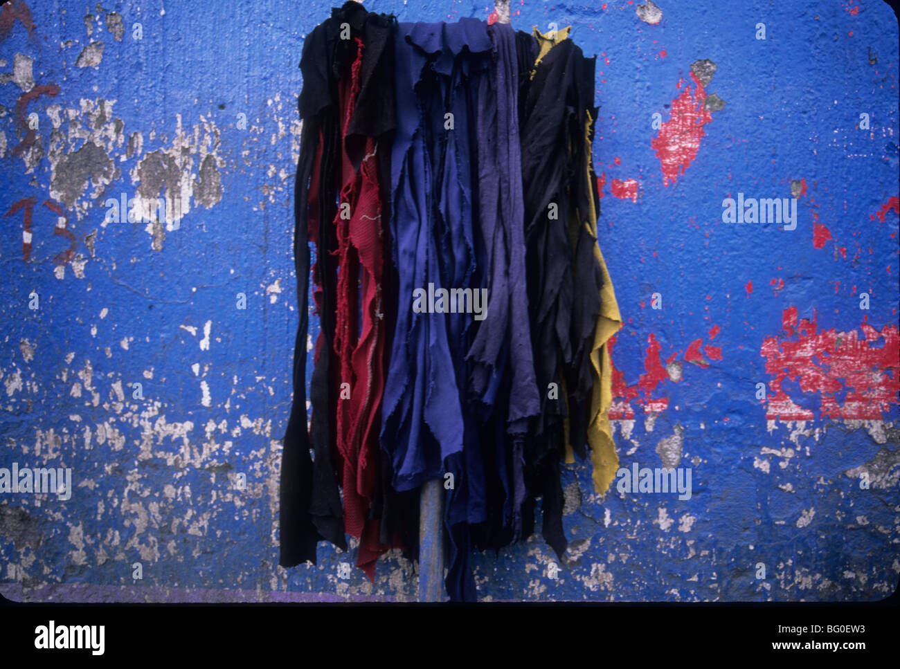 Rag mop agaist blue wall in Santa Cruz de la Quiche, Gutatemala Stock ...