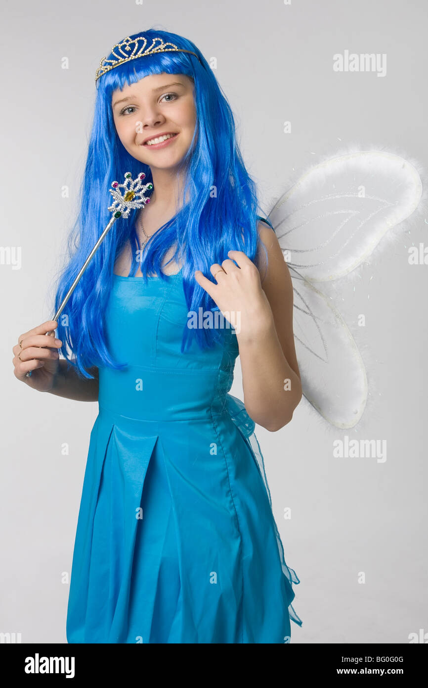 young beautiful girl with long blue hair and in blue dress with magic ...