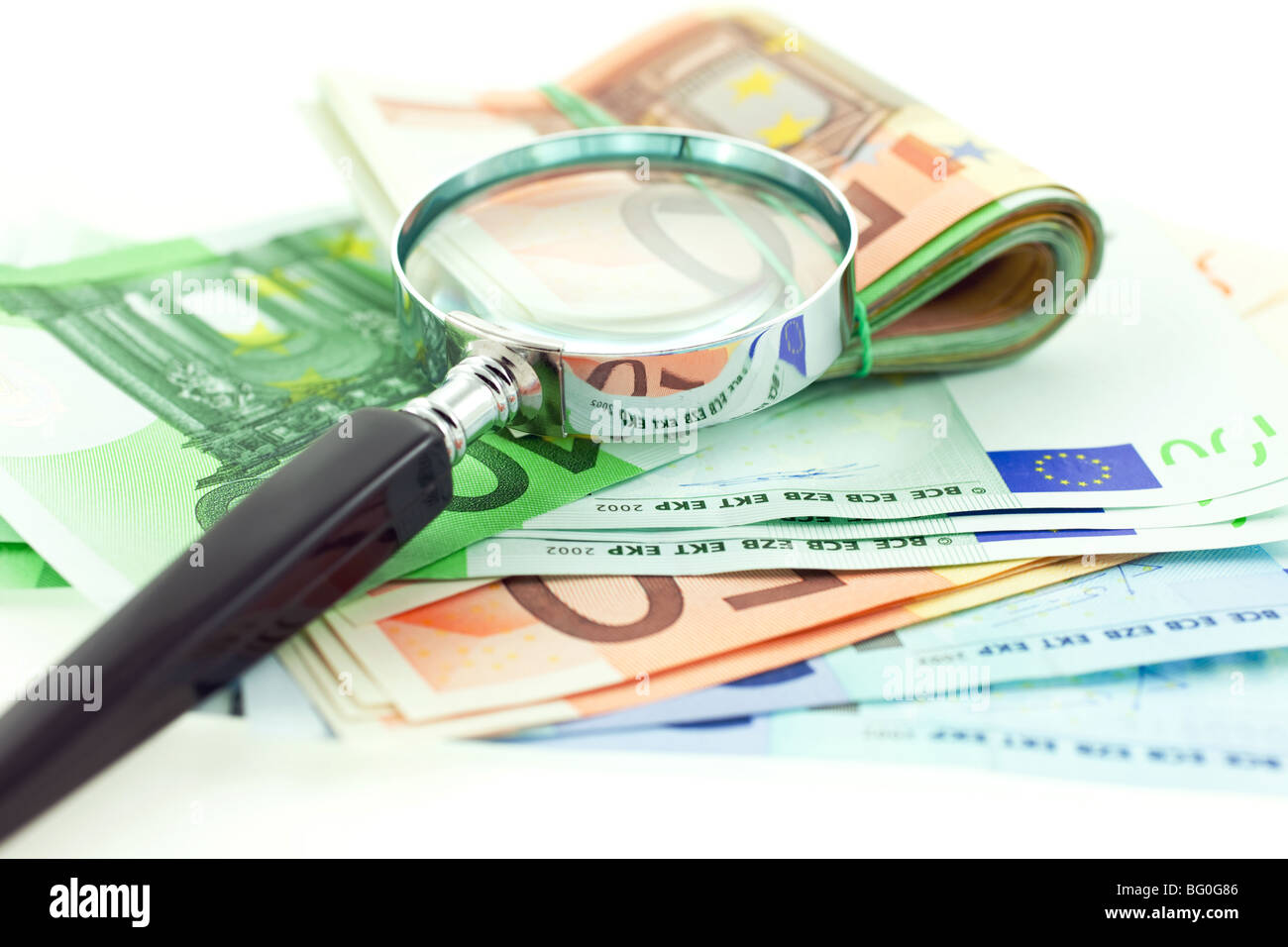 euro notes with magnifier on white background. small GRIP Stock Photo ...