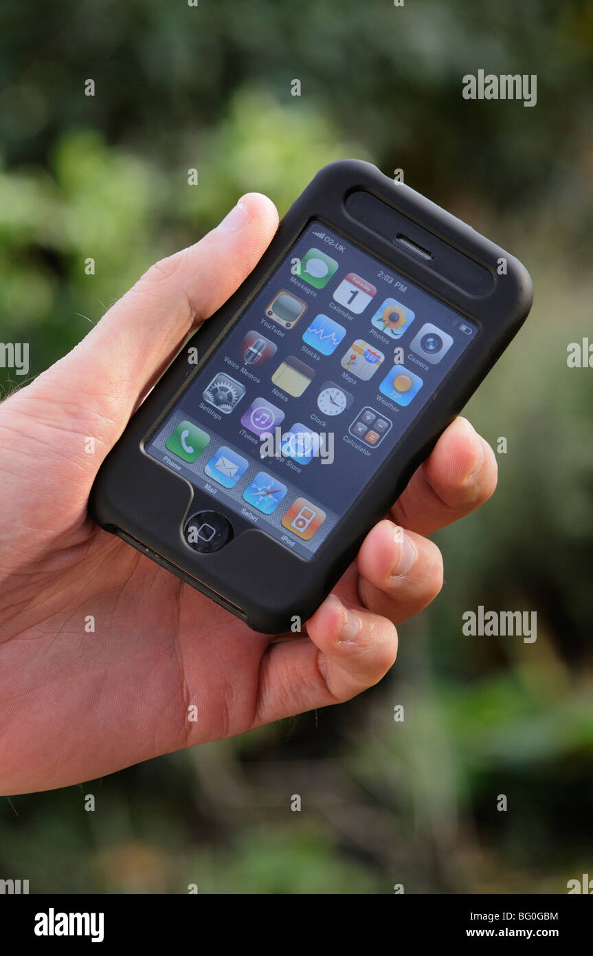 Man's hand operating a iPhone touch screen Stock Photo - Alamy