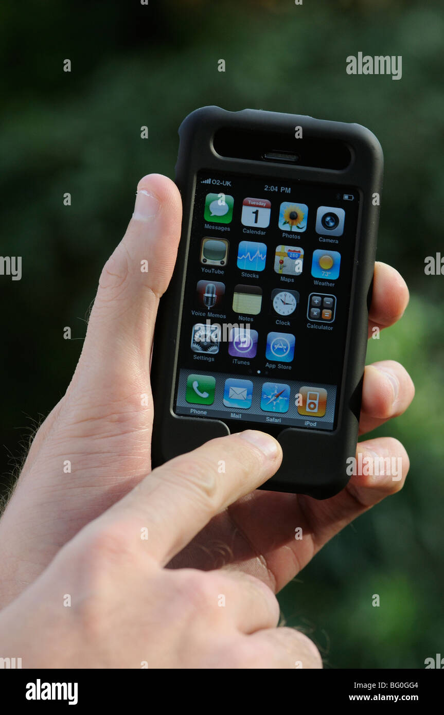 Man's hand operating a iPhone touch screen Stock Photo - Alamy