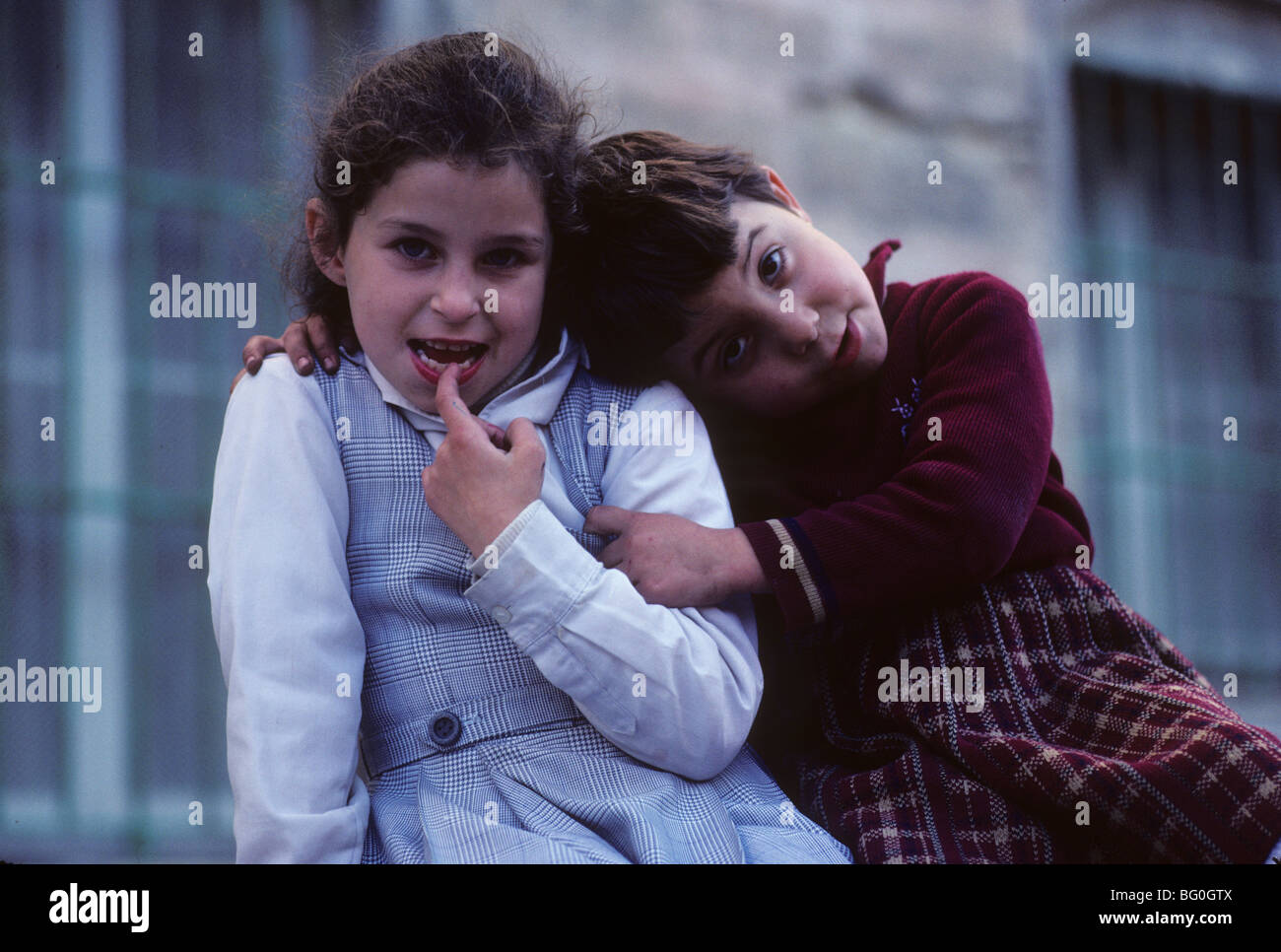 Two little girls hug, Cadiz, Spain Stock Photo - Alamy