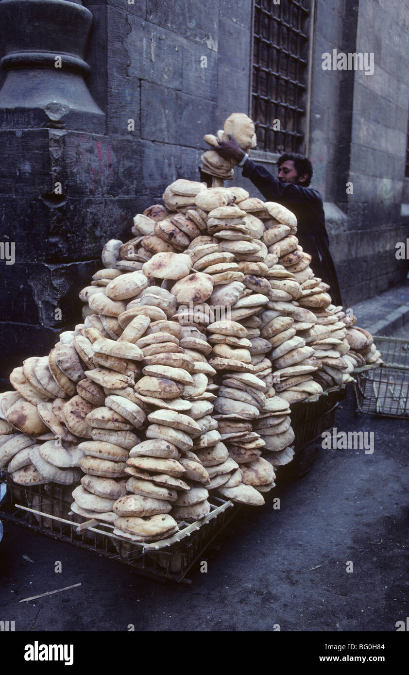 A baker piles his pita bread on a cart in Cairo, Egypt Stock Photo - Alamy