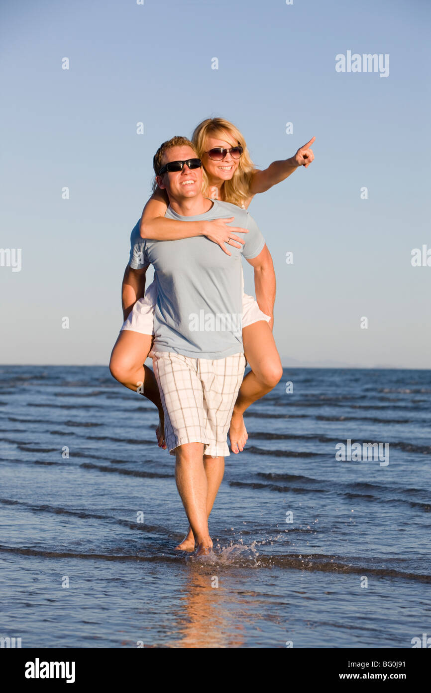 A young, attractive couple seaside Stock Photo - Alamy