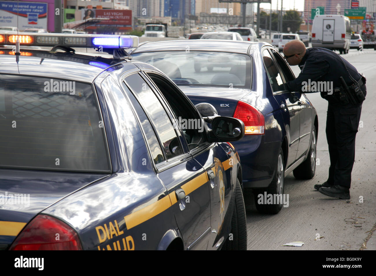 Nevada Highway Patrol State Trooper speaks with a driver about a ...