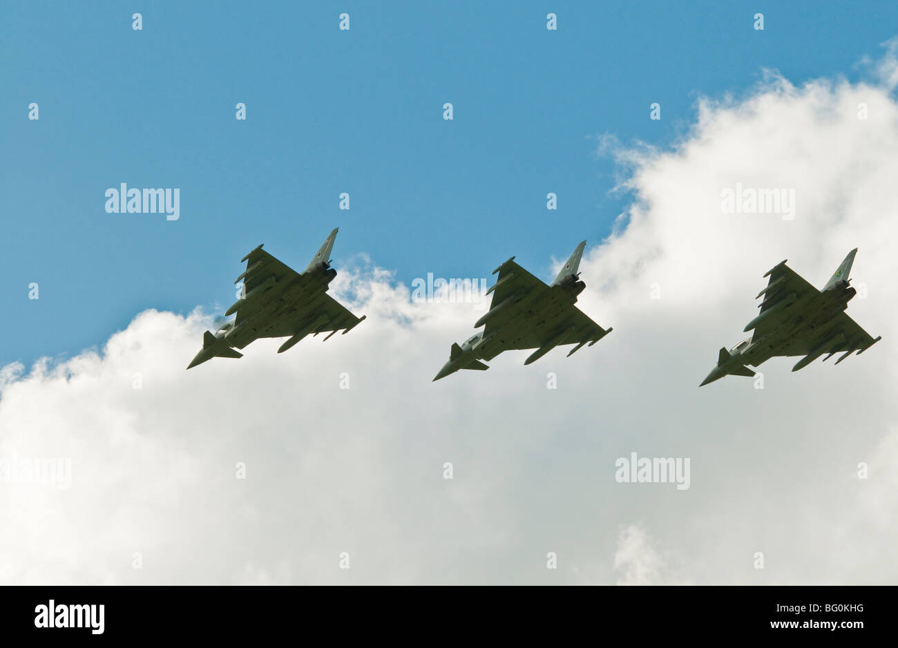 Three Typhoon fighter aircraft flying in close formation above RAF ...