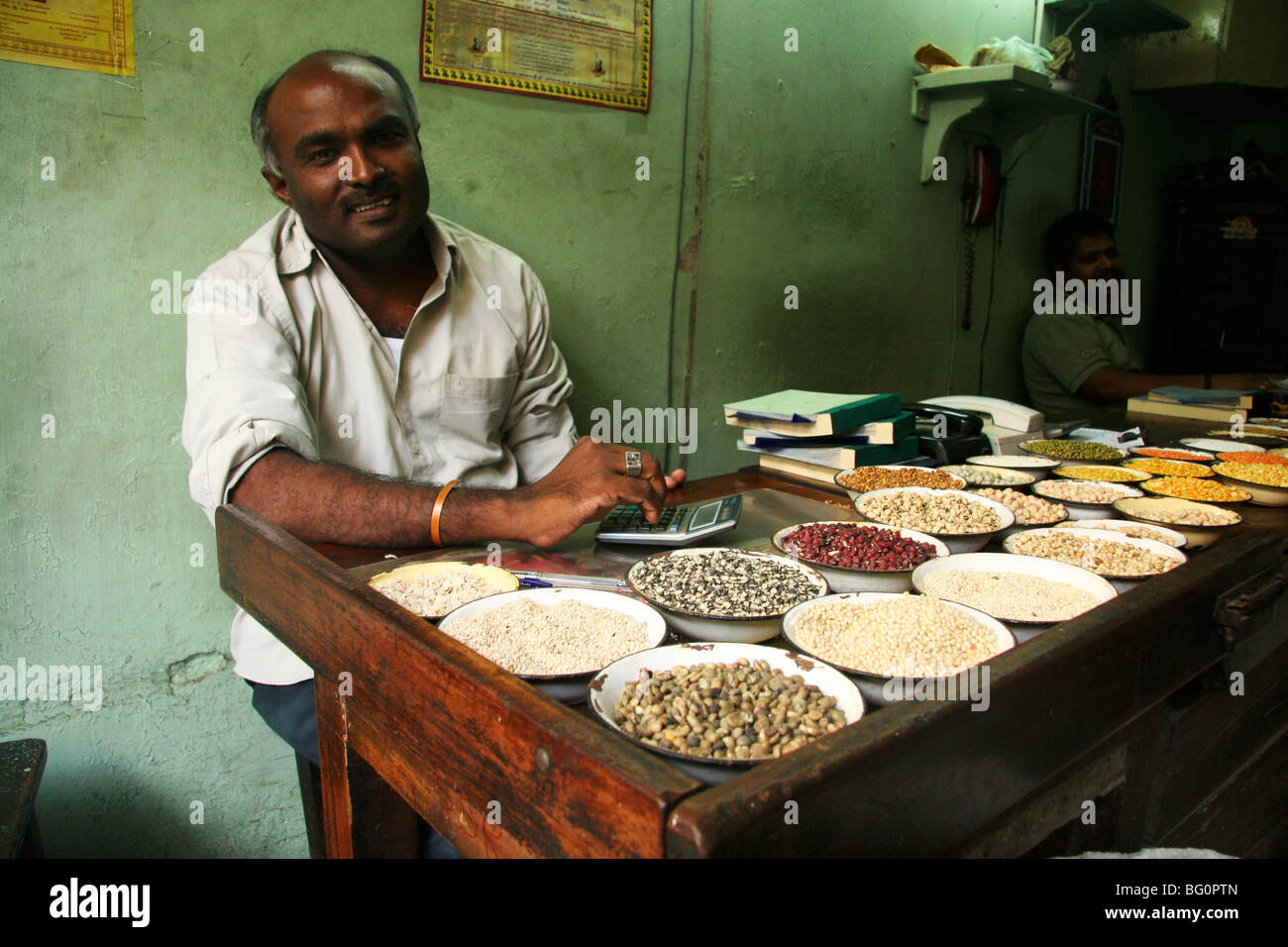A man works within a wholesale provisions store in the Pettah Market of ...