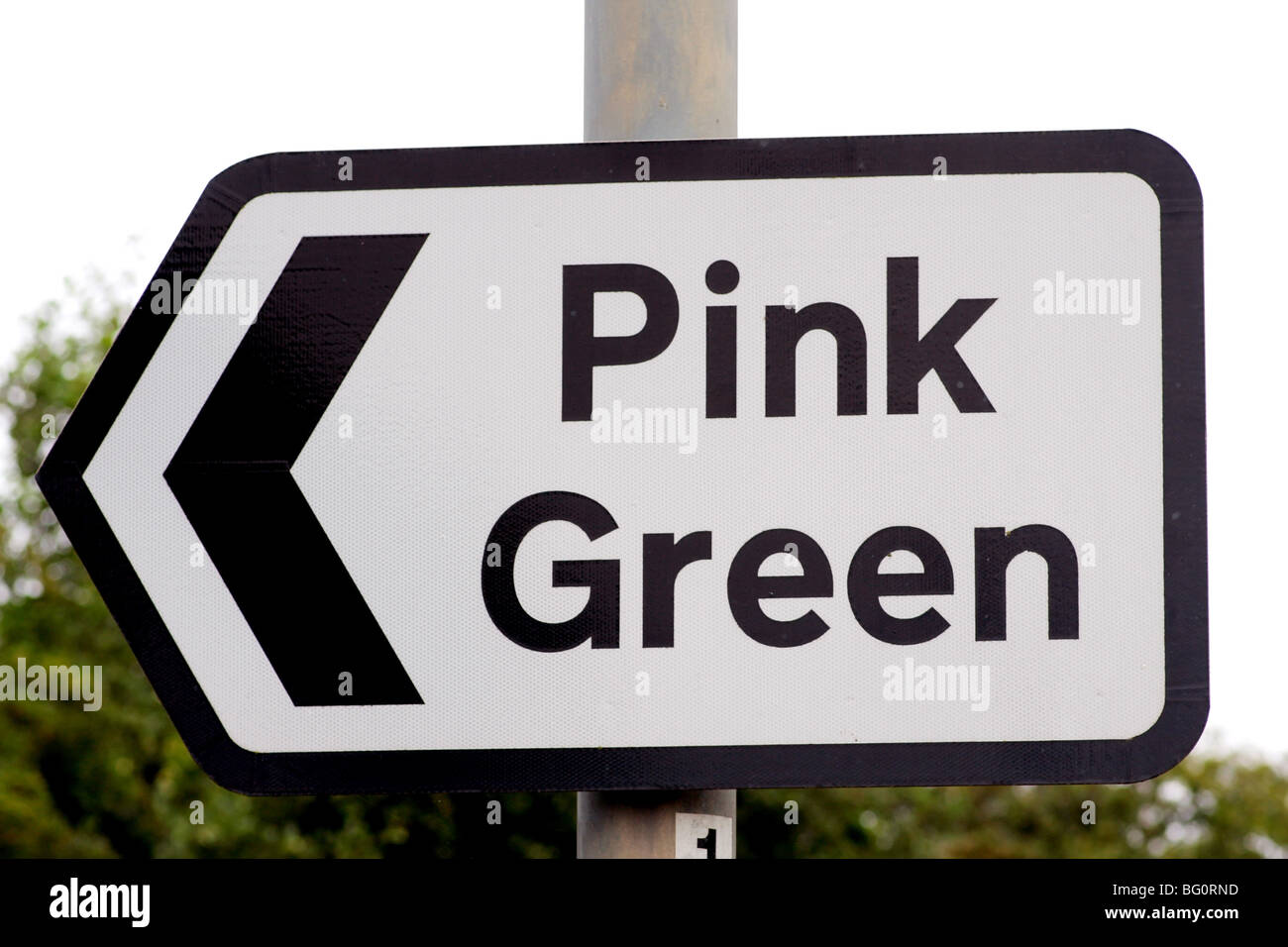 Road sign pointing towards Pink Green Stock Photo - Alamy