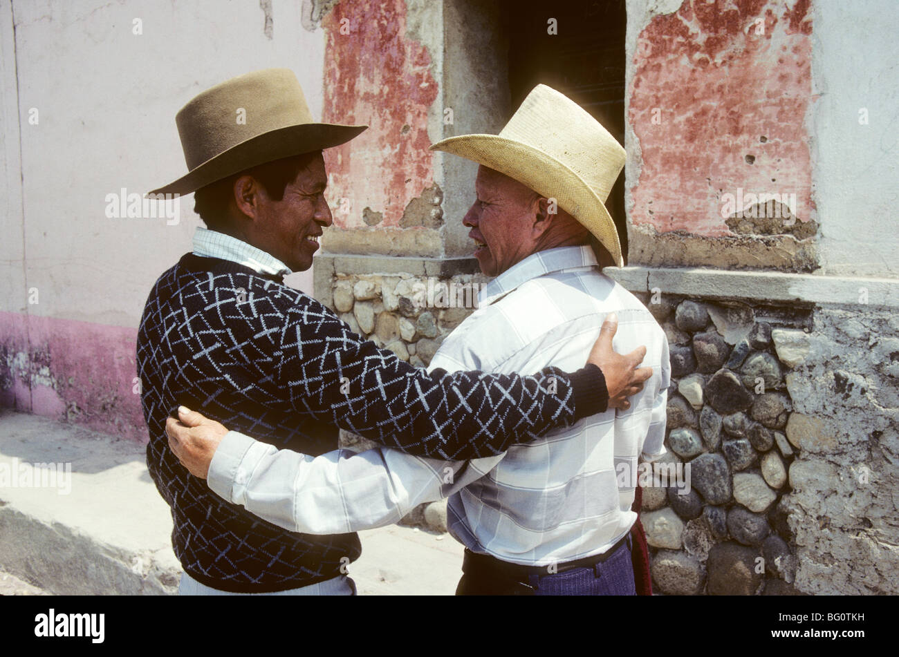 Two old friends greet each other in Xela, Guatemala Stock Photo - Alamy