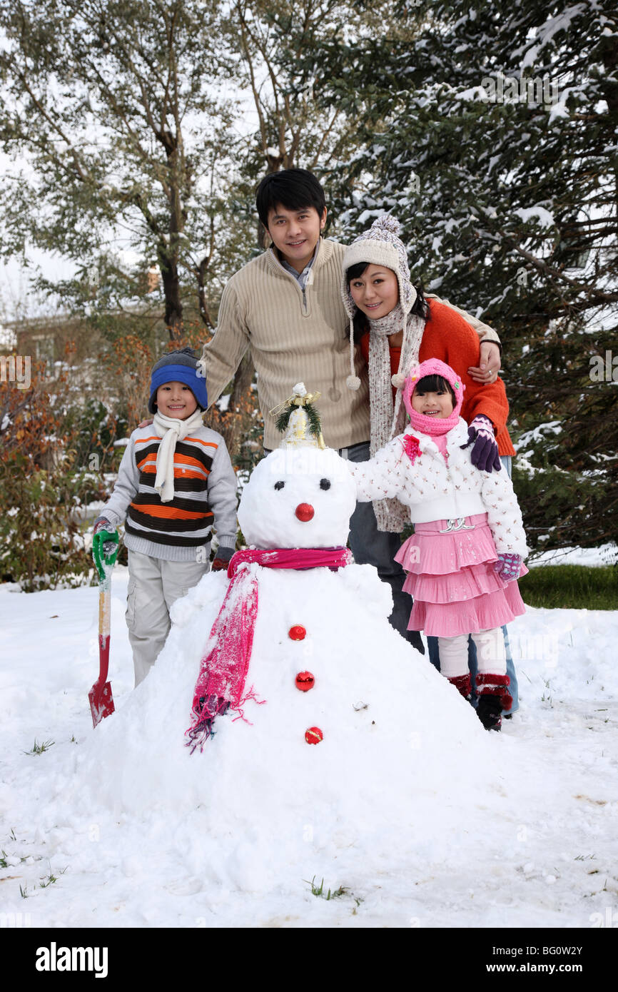 Chinese child making snowman hi-res stock photography and images - Alamy