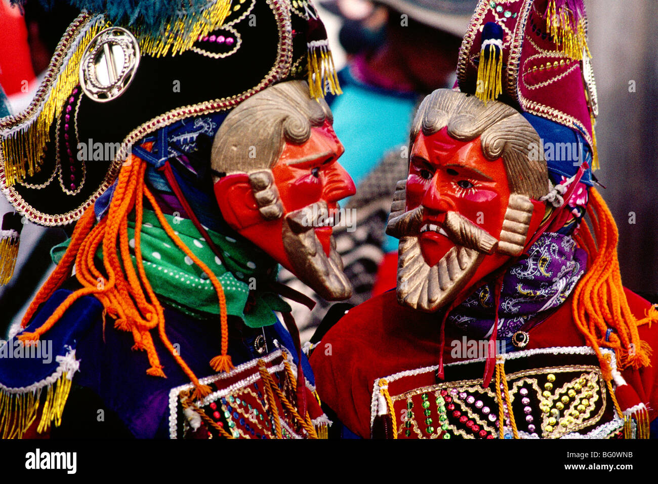 Two participants wearing masks representing the Spanish conquerors over ...