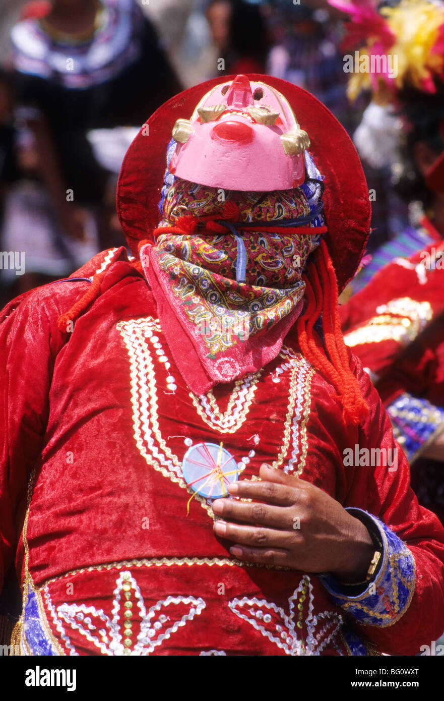 A pole flyer (Los Voladores) looks up at the 100 foot pole on which his ...