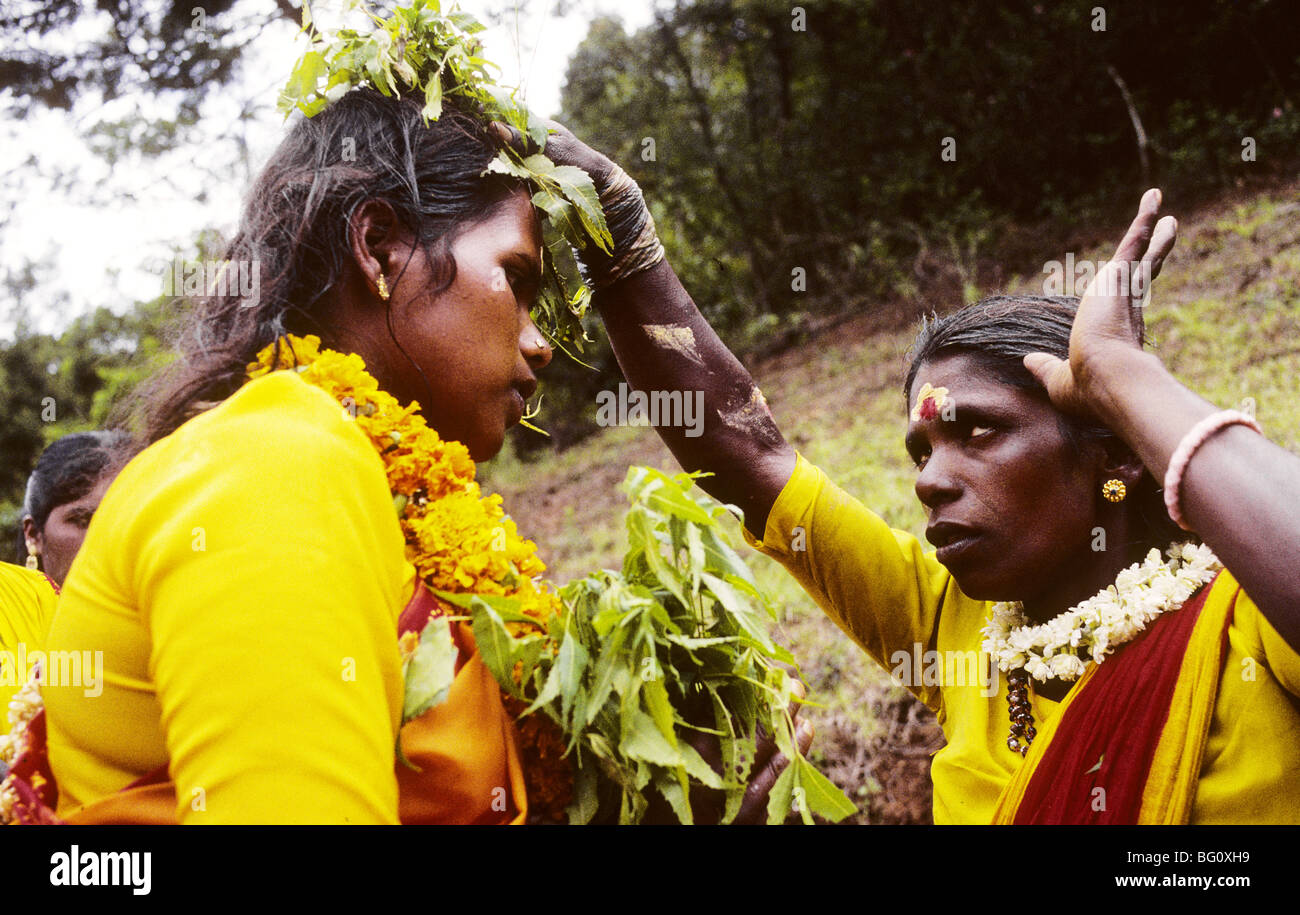 In preparation for participating in a fire walking ritual in Manjacombi ...