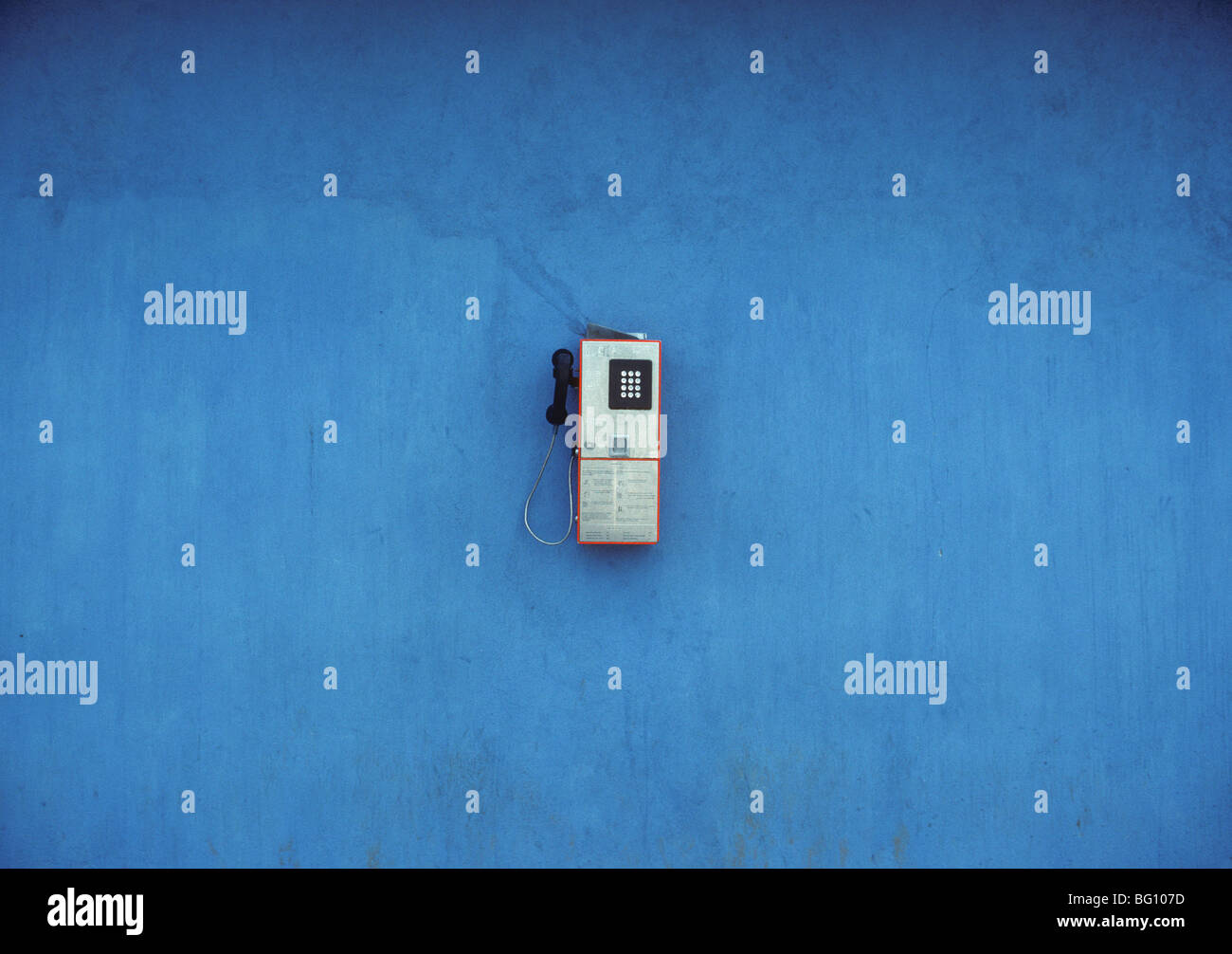 Payphone on a blue wall in Santa Cruz de la Quiche, Guatemala Stock ...