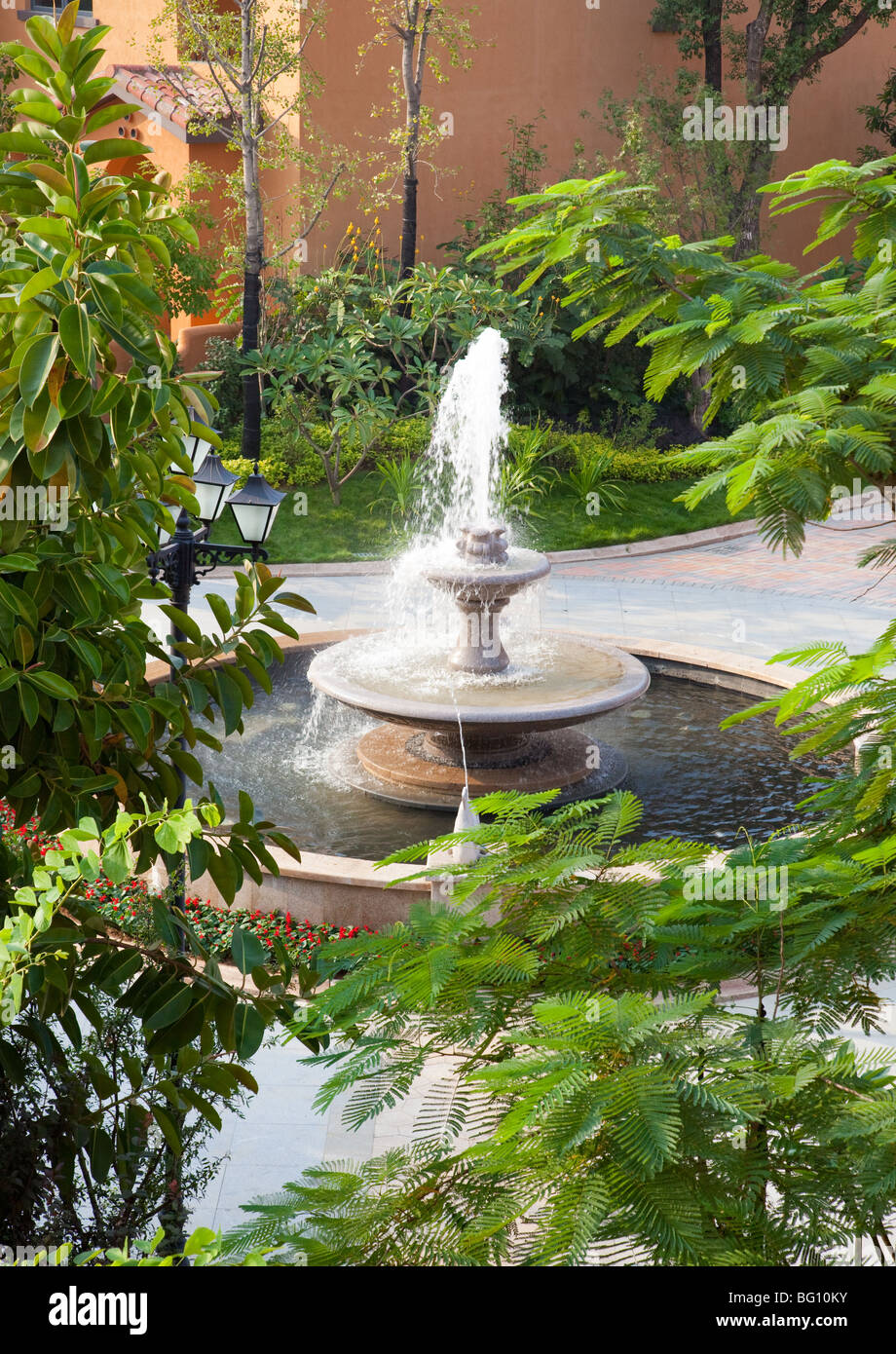 Fountain and trees in Garden Stock Photo - Alamy