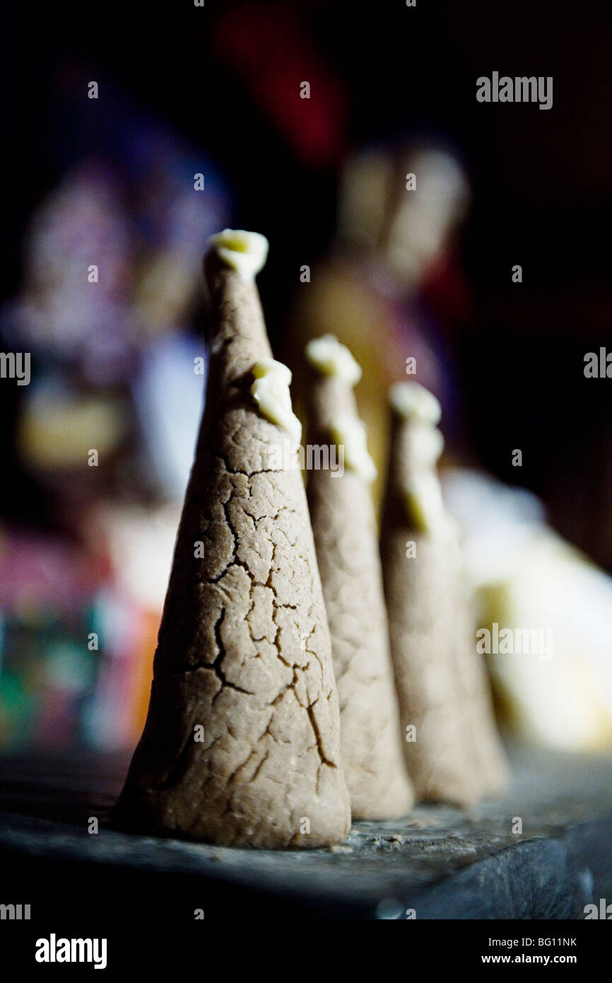 Offerings made of tsampa, roasted barley flour, in a Tibetan Buddhist ...