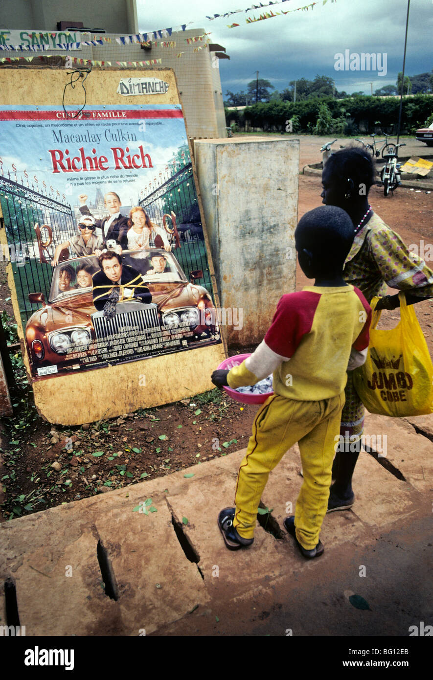 Two children look at a movie poster in San, Mali, West Africa Stock ...