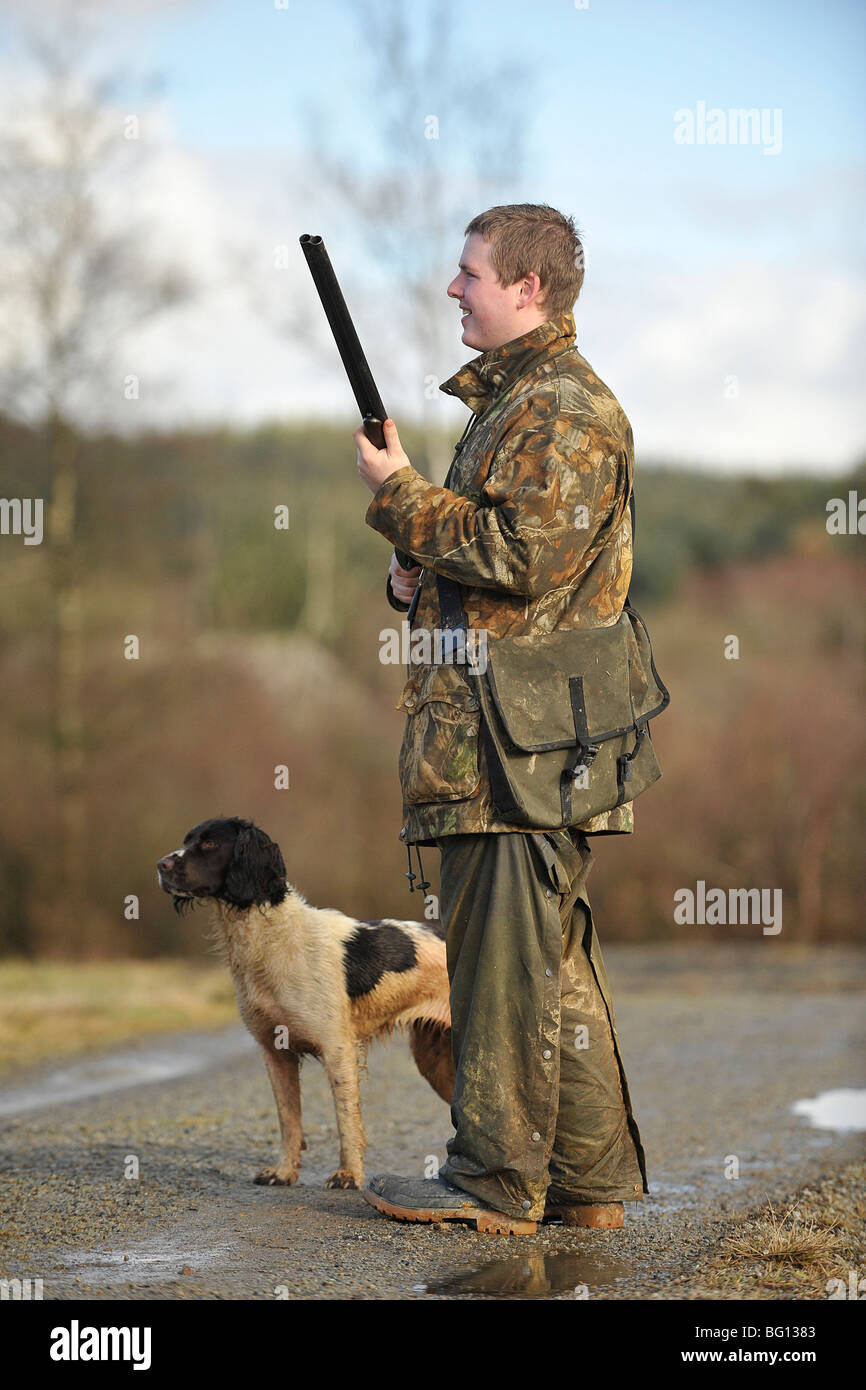 young man and his spaniel out rough shooting Stock Photo - Alamy