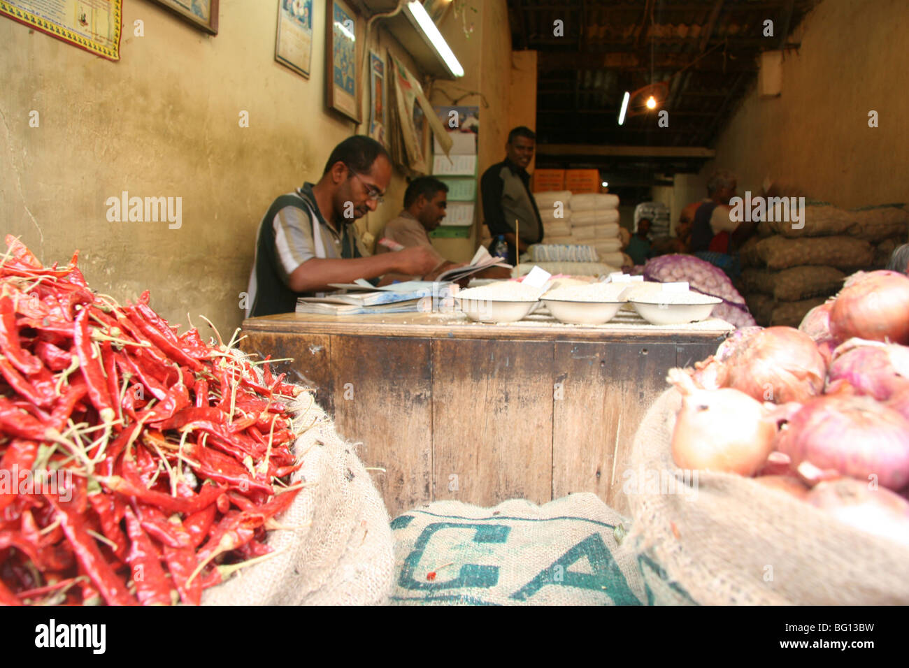 Men work within a wholesale provisions store in the Pettah Market of ...