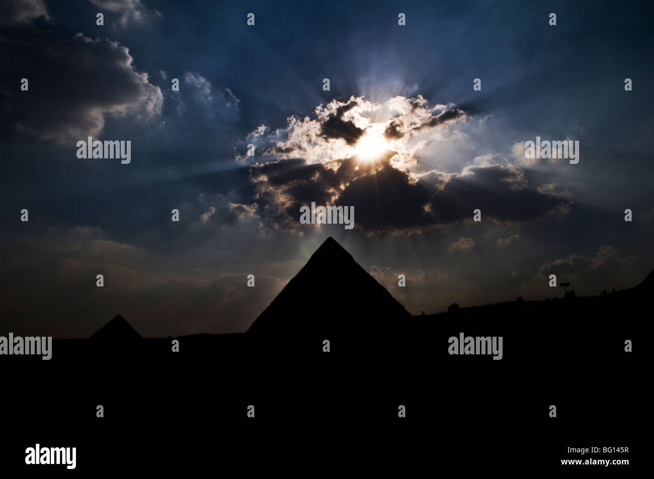 Sunset over the great Pyramids of Giza Stock Photo - Alamy