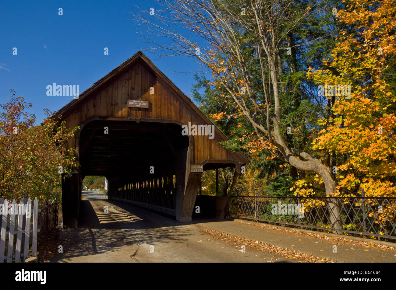 Autumn fall colours around traditional timber covered bridge (Middle ...
