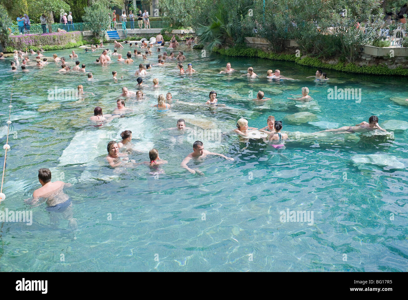 People bathing in hot spring mineral water pool, Hierapolis, Pamukkale ...