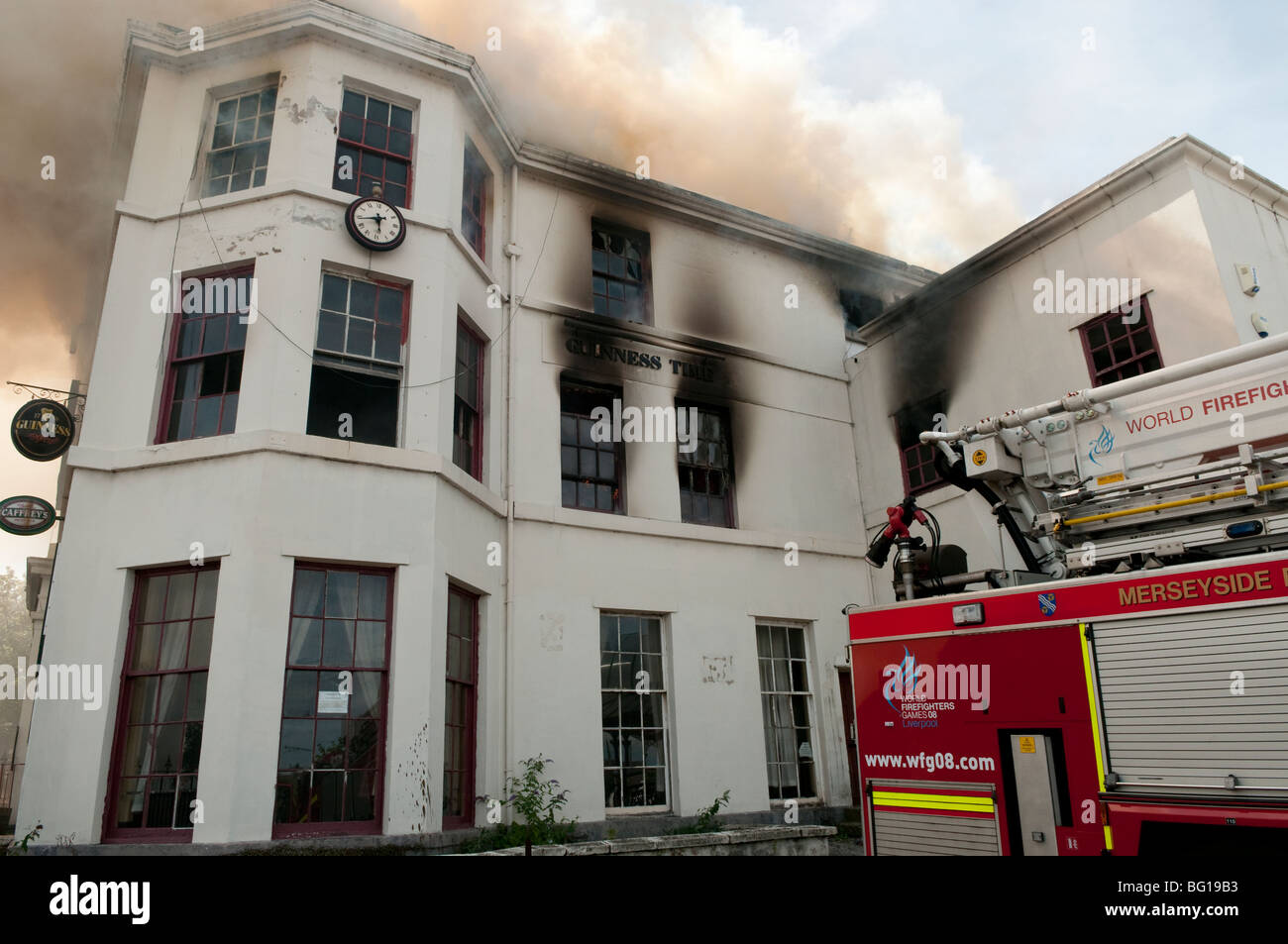 Hotel on fire with smoke from windows and roof Stock Photo - Alamy