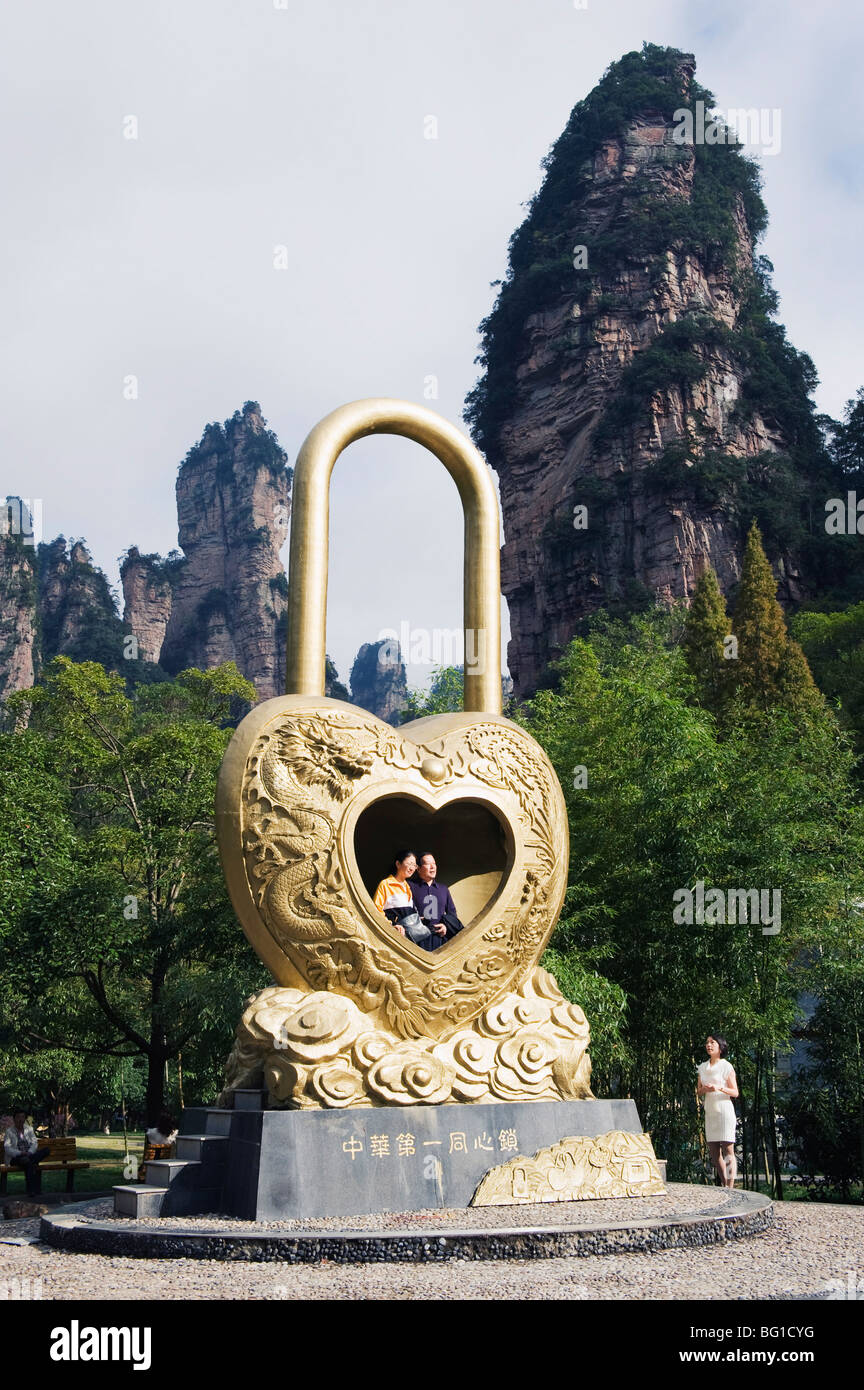 A couple in a giant love heart lock, Zhangjiajie Forest Park ...