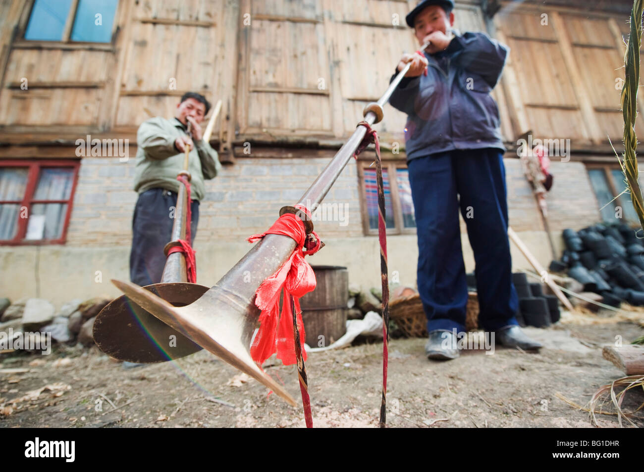 Men playing traditional horn instruments at a Lunar New Year festival ...