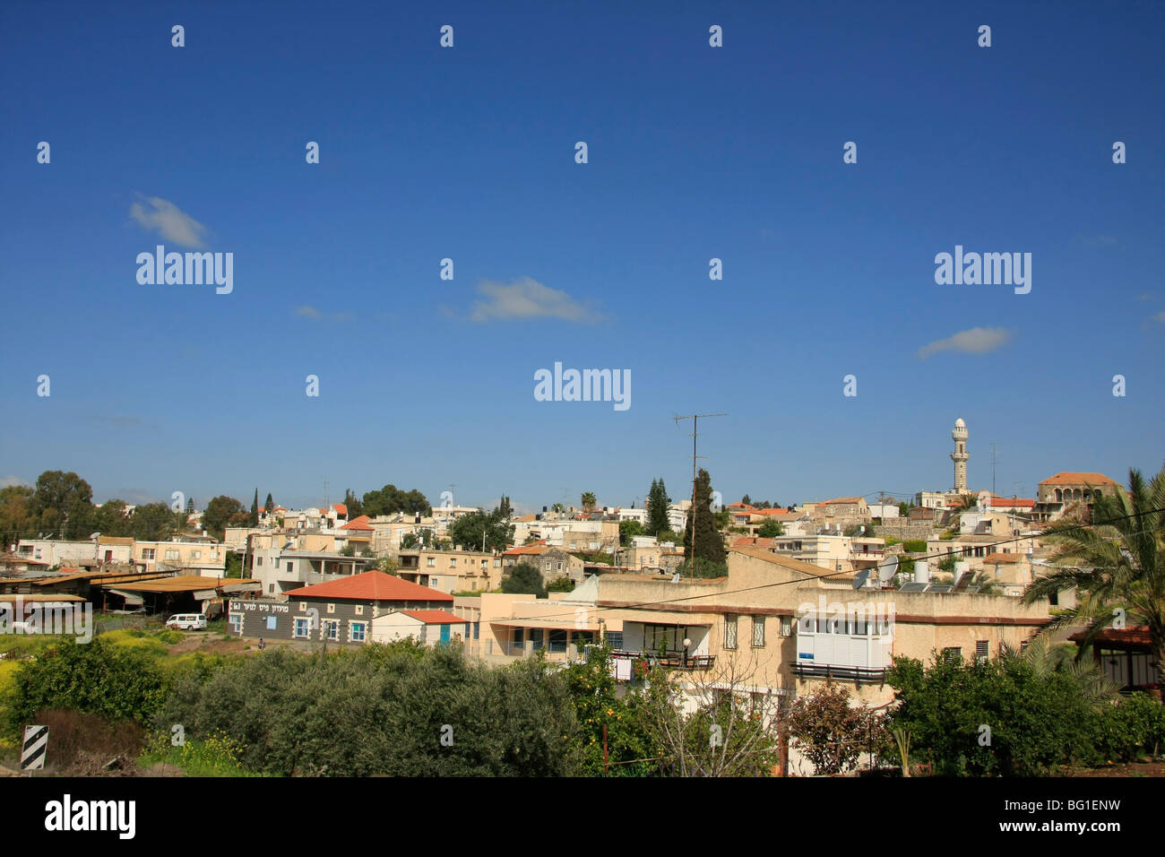 Israel, Lower Galilee. Circassian village Kfar Kama as seen from road ...