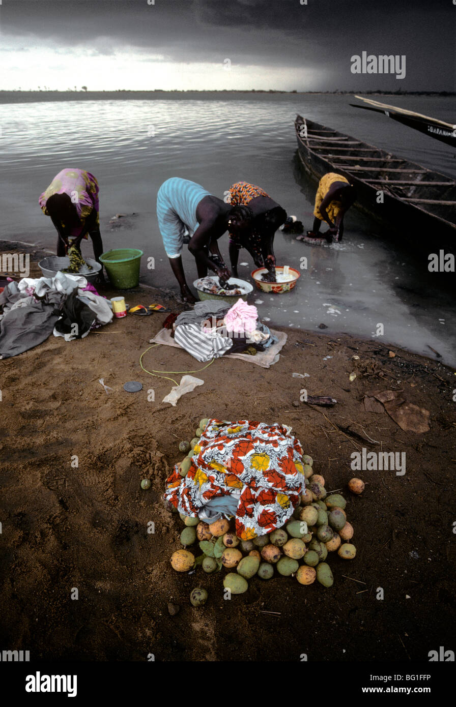 African women wash in river hi-res stock photography and images - Alamy