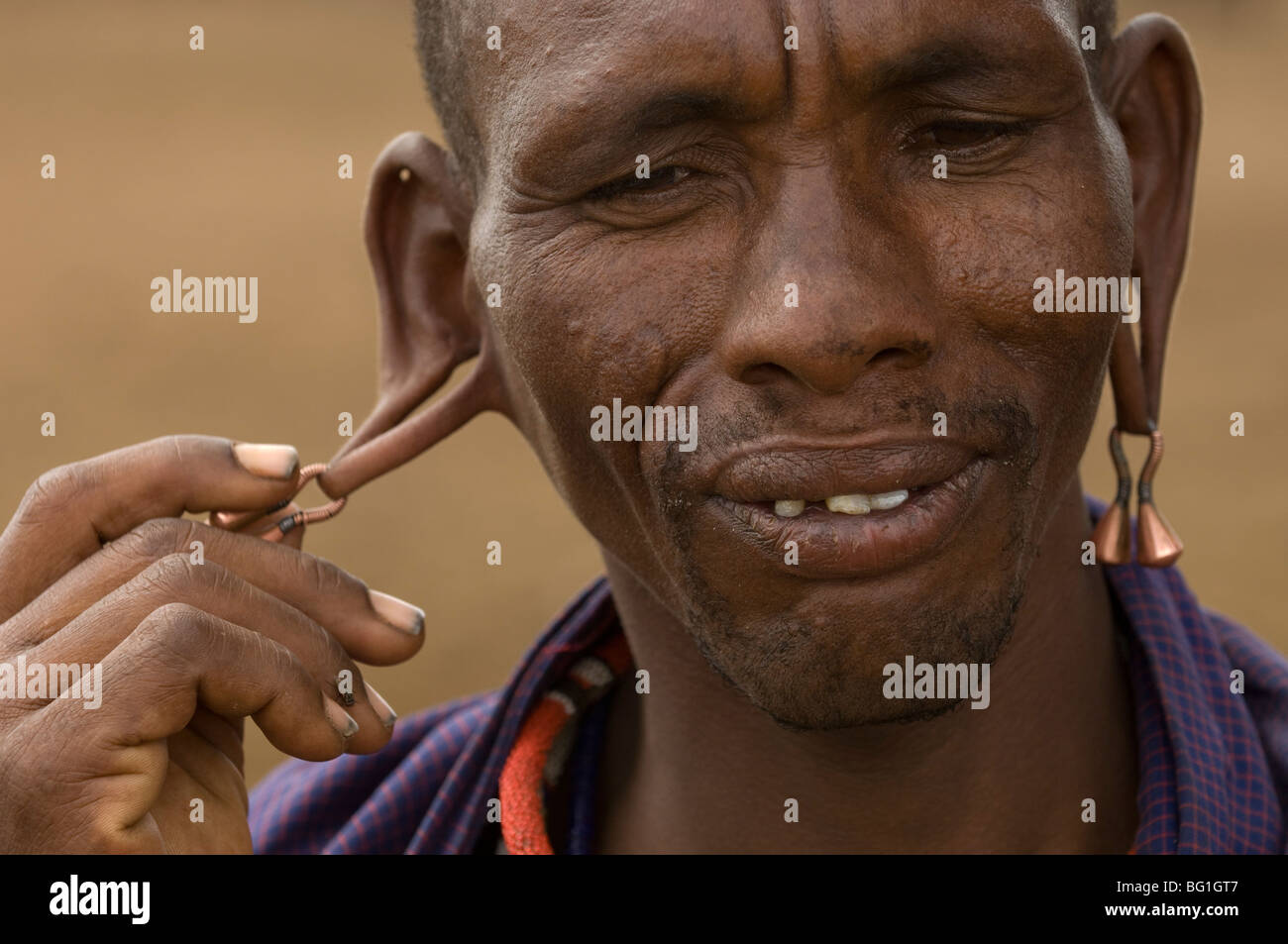 Man with pierced ears hi-res stock photography and images - Alamy