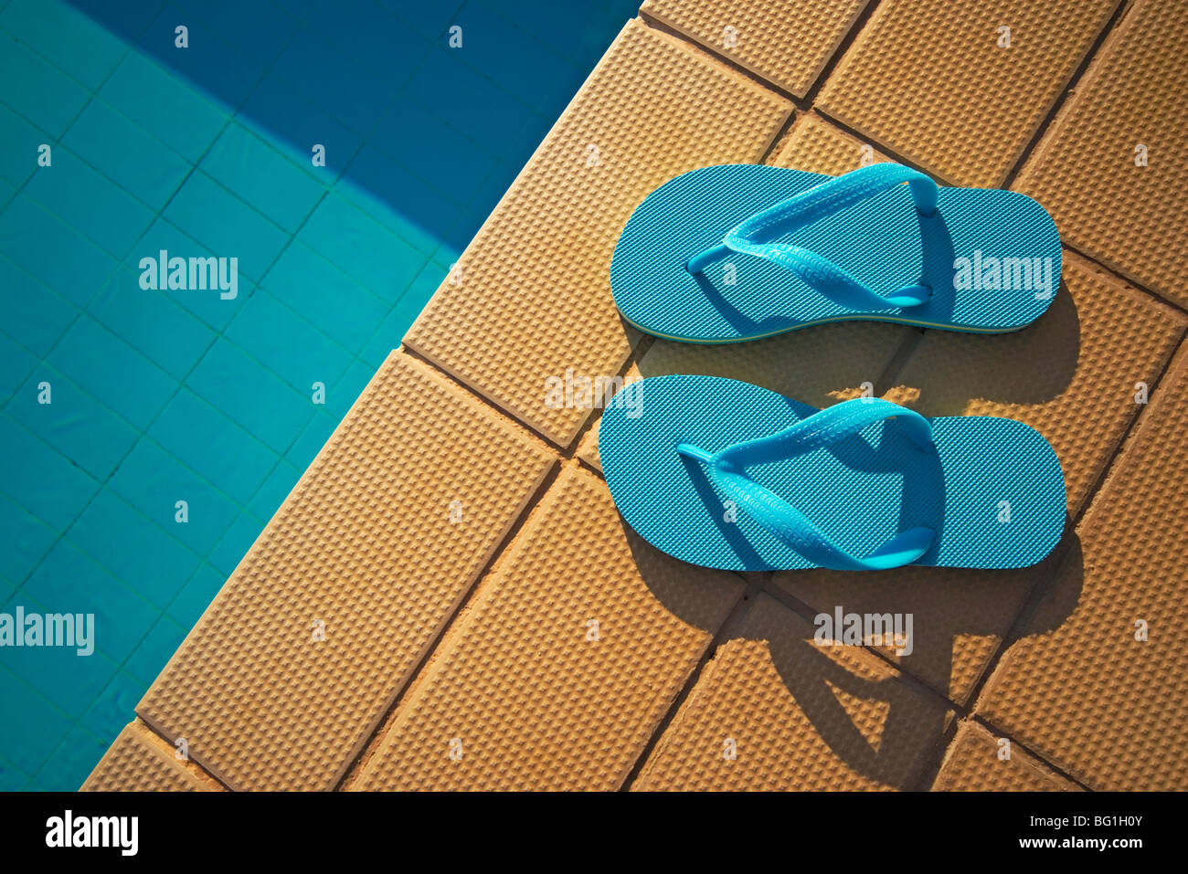Flip Flops by the pool Stock Photo - Alamy