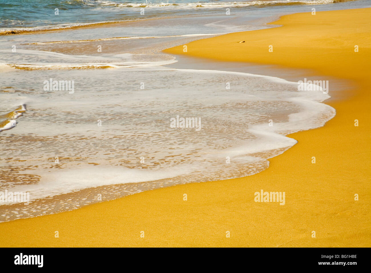 Tide on the beach Stock Photo - Alamy