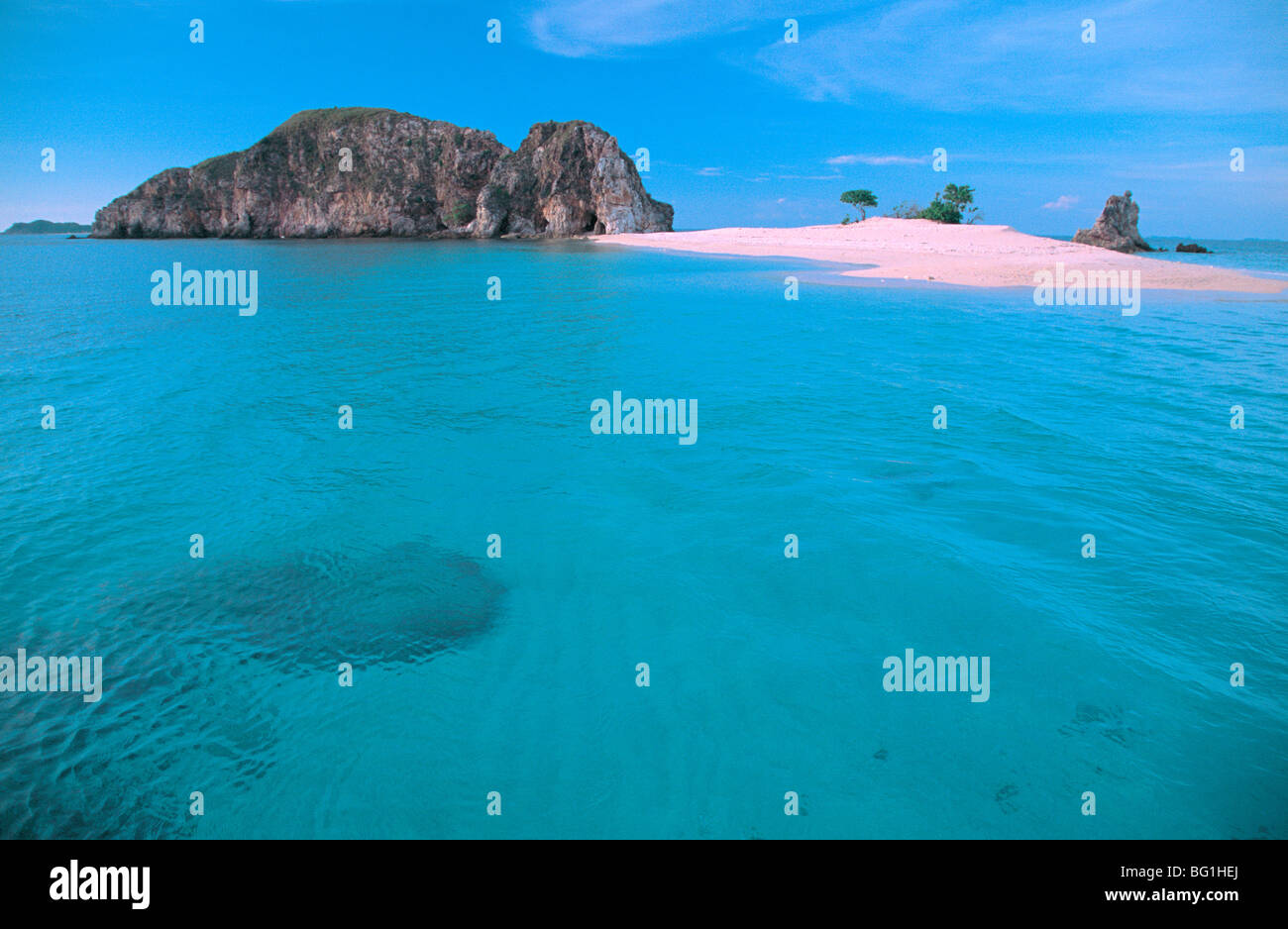 An uninhabited small isle with a long sandy beach in Maricaban Bay in ...