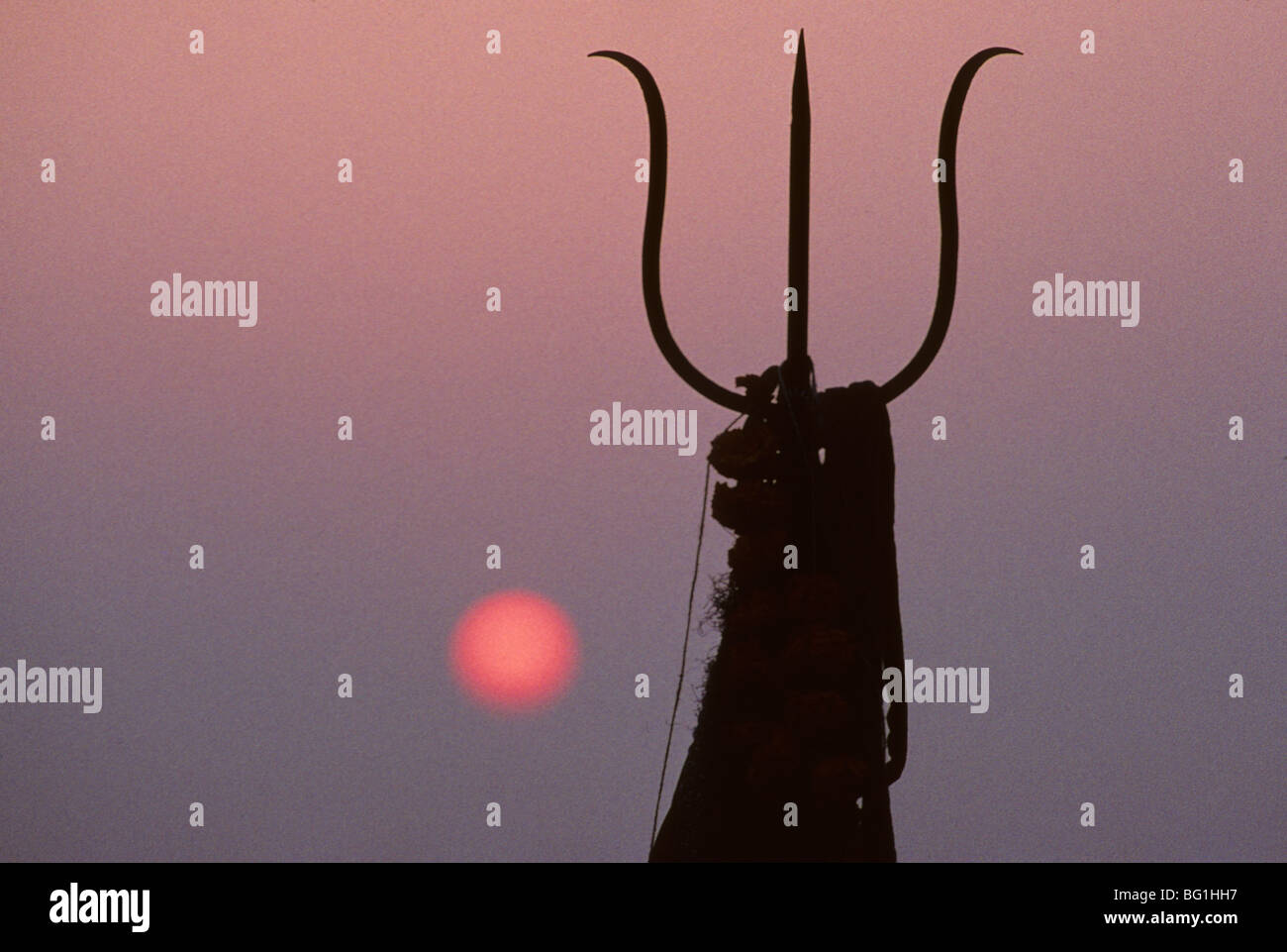 A Hindu trident at sunrise, Varanasi, India Stock Photo - Alamy